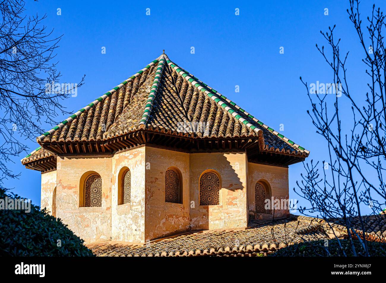 Granada, Spain - July 17, 2024: Tiled roof of a dome in an ancient ...
