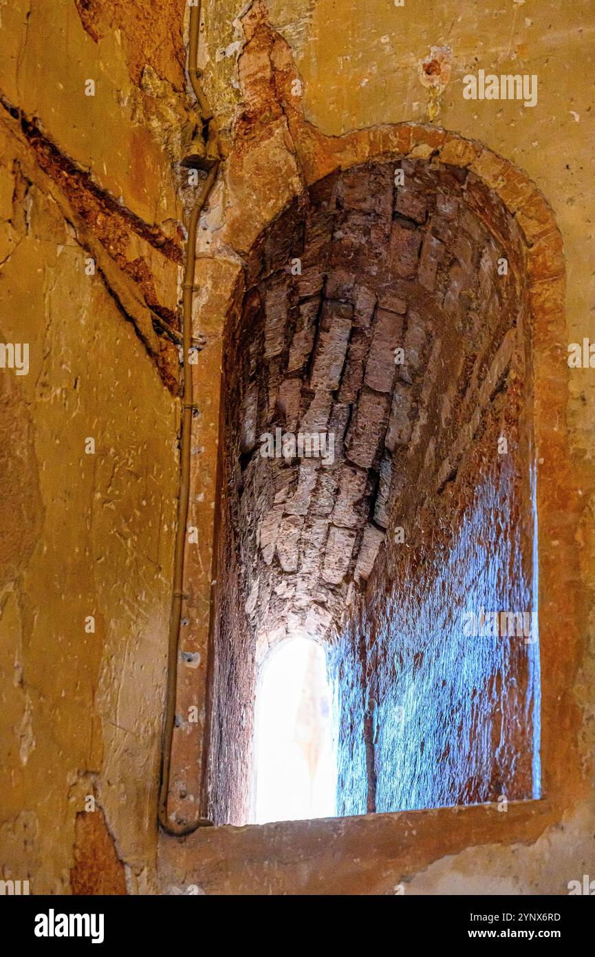 Granada, Spain - July 17, 2024: Detail of medieval arched window in the ...