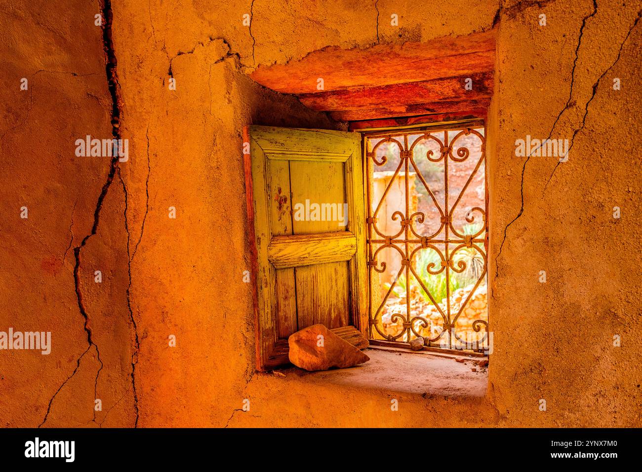 light coming through window of a derelict pise / pisé building in a ...