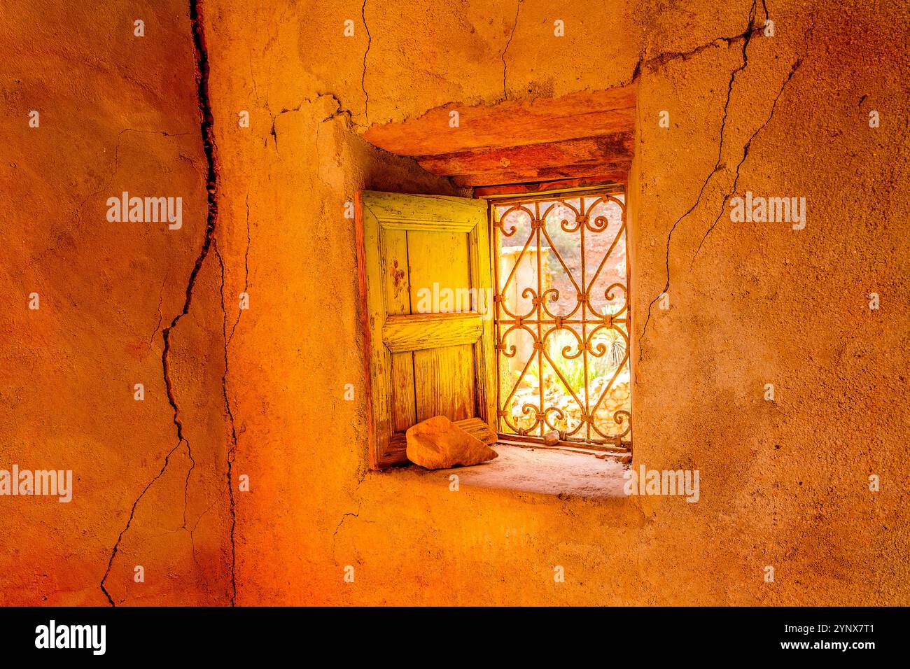 light coming through window of a derelict pise / pisé building in a ...