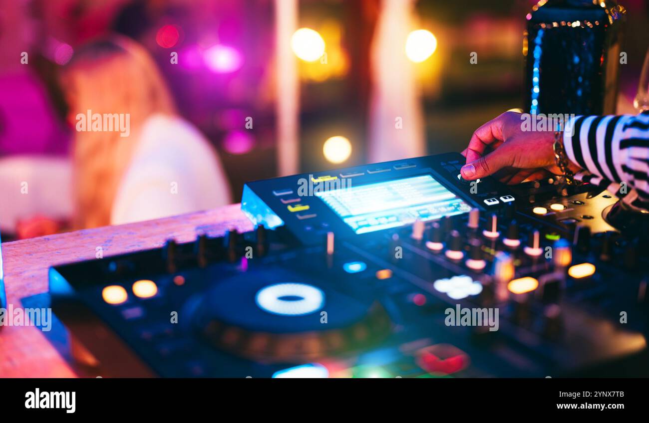 Dj playing music during winter holiday party inside cocktail bar ...