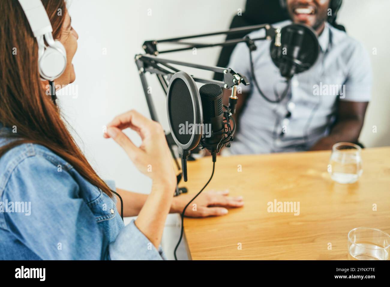Female host speaker making a podcast interview during live streaming ...