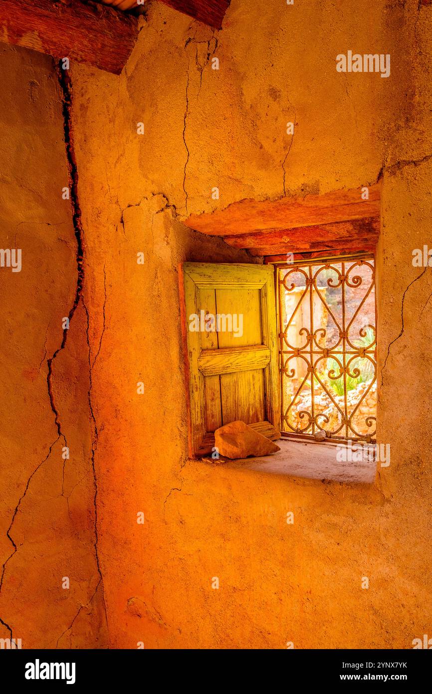 light coming through window of a derelict pise / pisé building in a ...