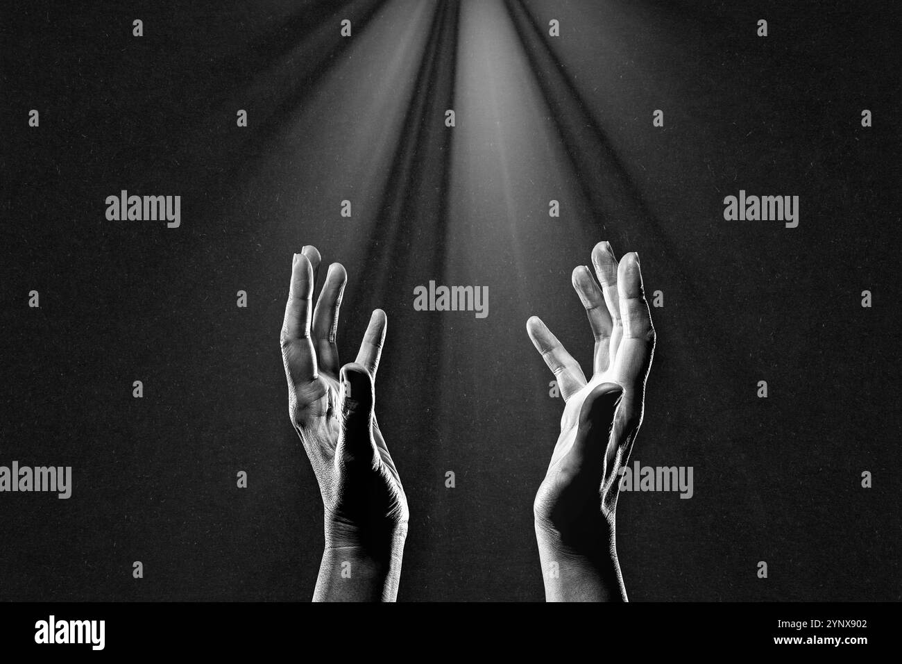 Hand Praying Reaching Light in Black and White on Textured Paper ...