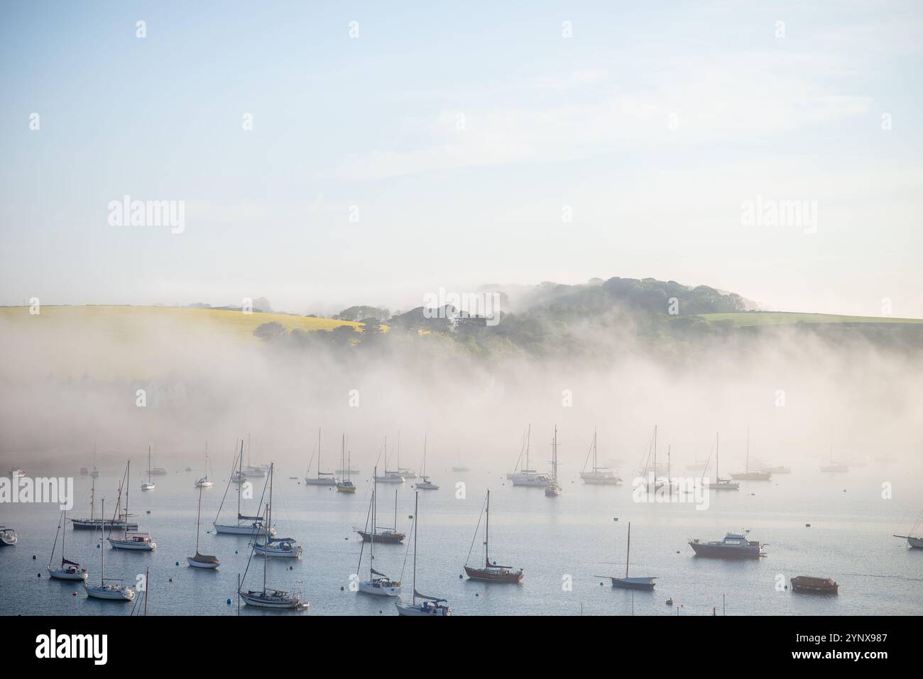 Misty morning across the Falmouth River with yachts, summer, UK Stock ...