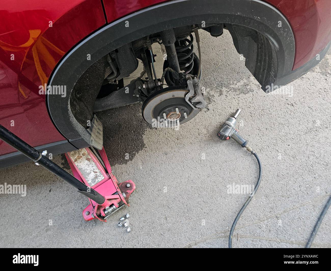 Tyre repair scene, emergency changing tyres, tyre fitting with air ...