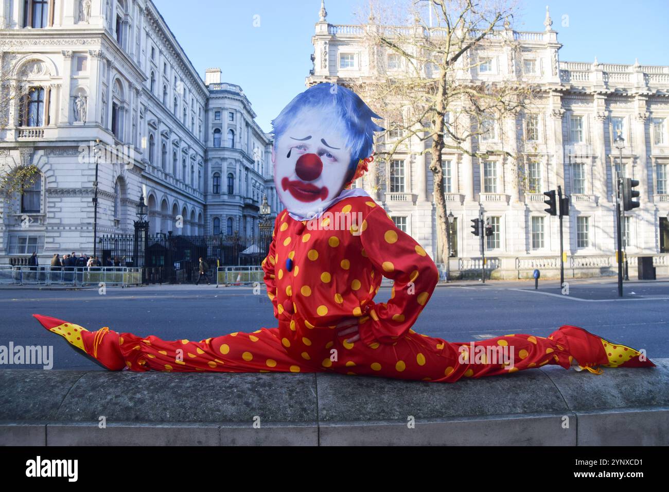 London, UK. 26th November 2024. PETA activists dressed as clowns and ...