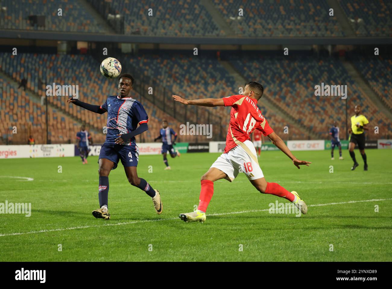 EGYPT, CAIRO, 26 NOVEMBER 2024 : Attiat Allah of Al Ahly SC and Adama Traore of Stade d Abidjan ...