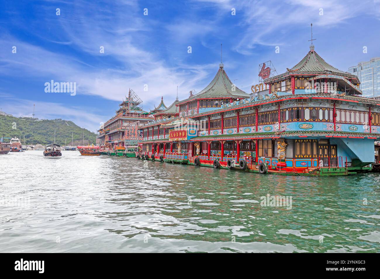 Colorful floating restaurant with intricate Asian architecture on a ...