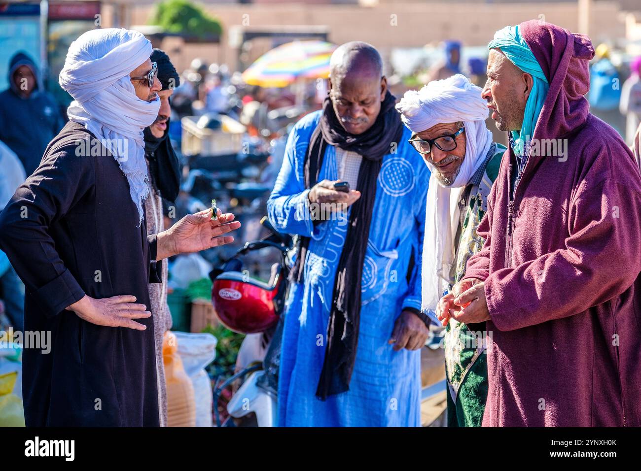 Traditionally dressed Moroccan Berber men at a souk / market near Tata ...