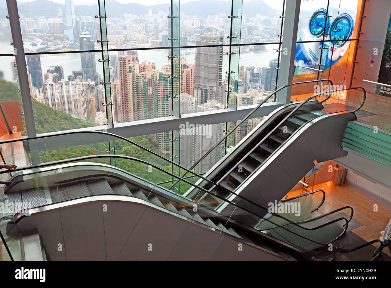 Multi-level escalators in a modern shopping mall with dynamic composition and vibrant ...