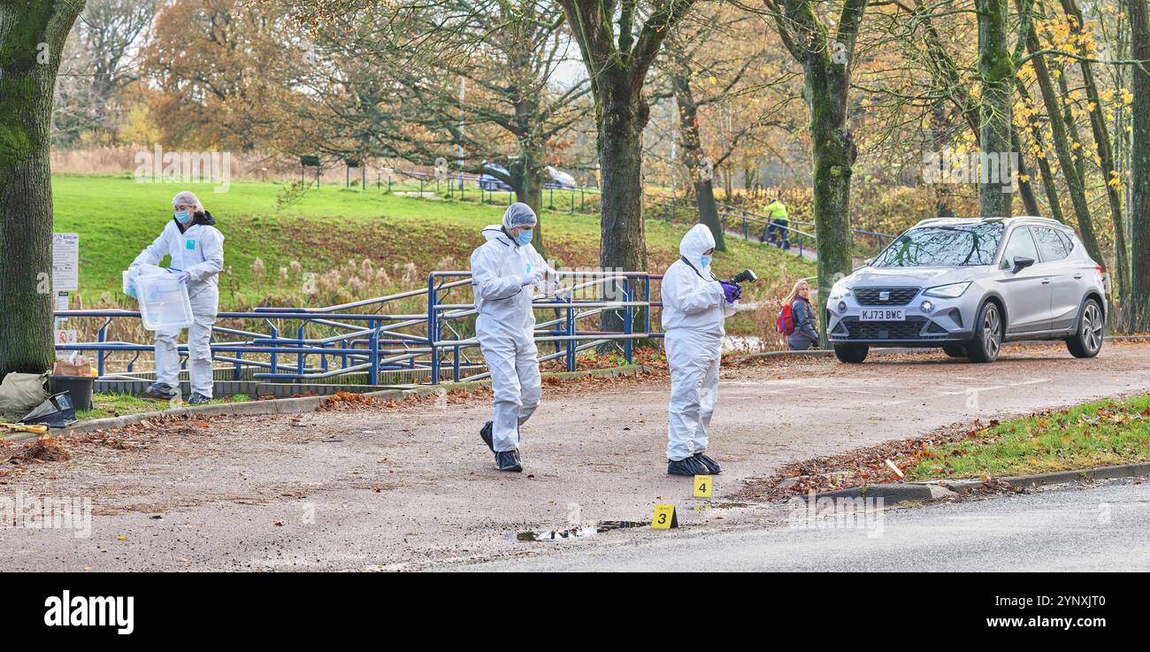 At a parking layby beside the boating lake in Corby, England, three ...