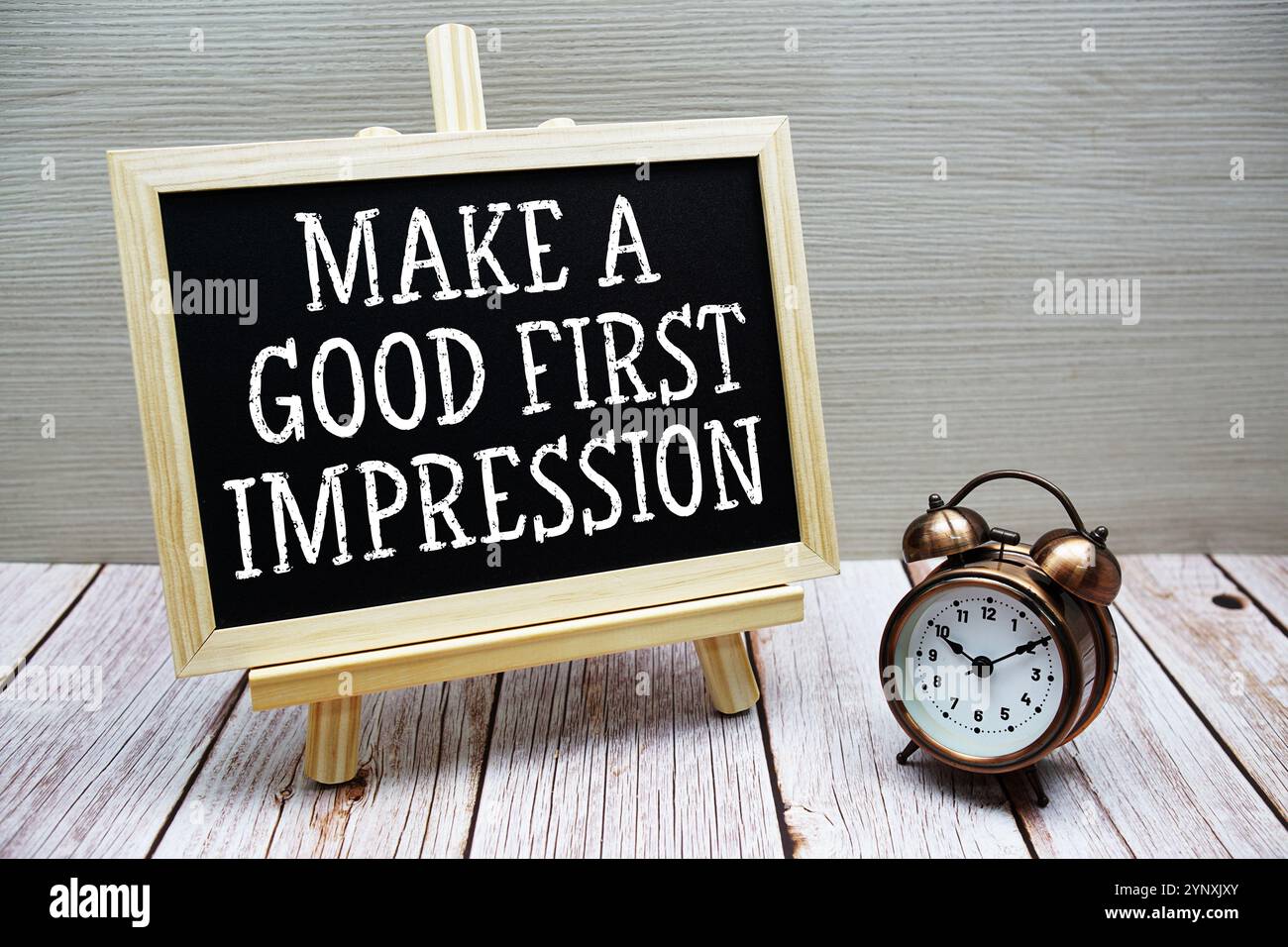 Make A Good First Impression text written on chalkboard with alarm ...
