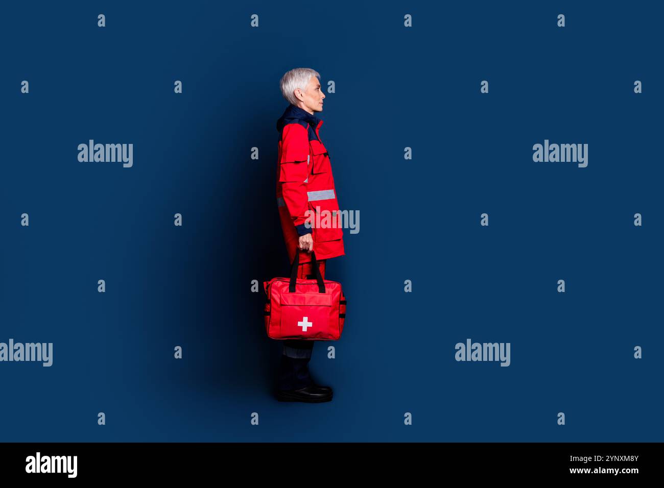 Full size photo of pretty retired female ambulance doctor first aid kit ...