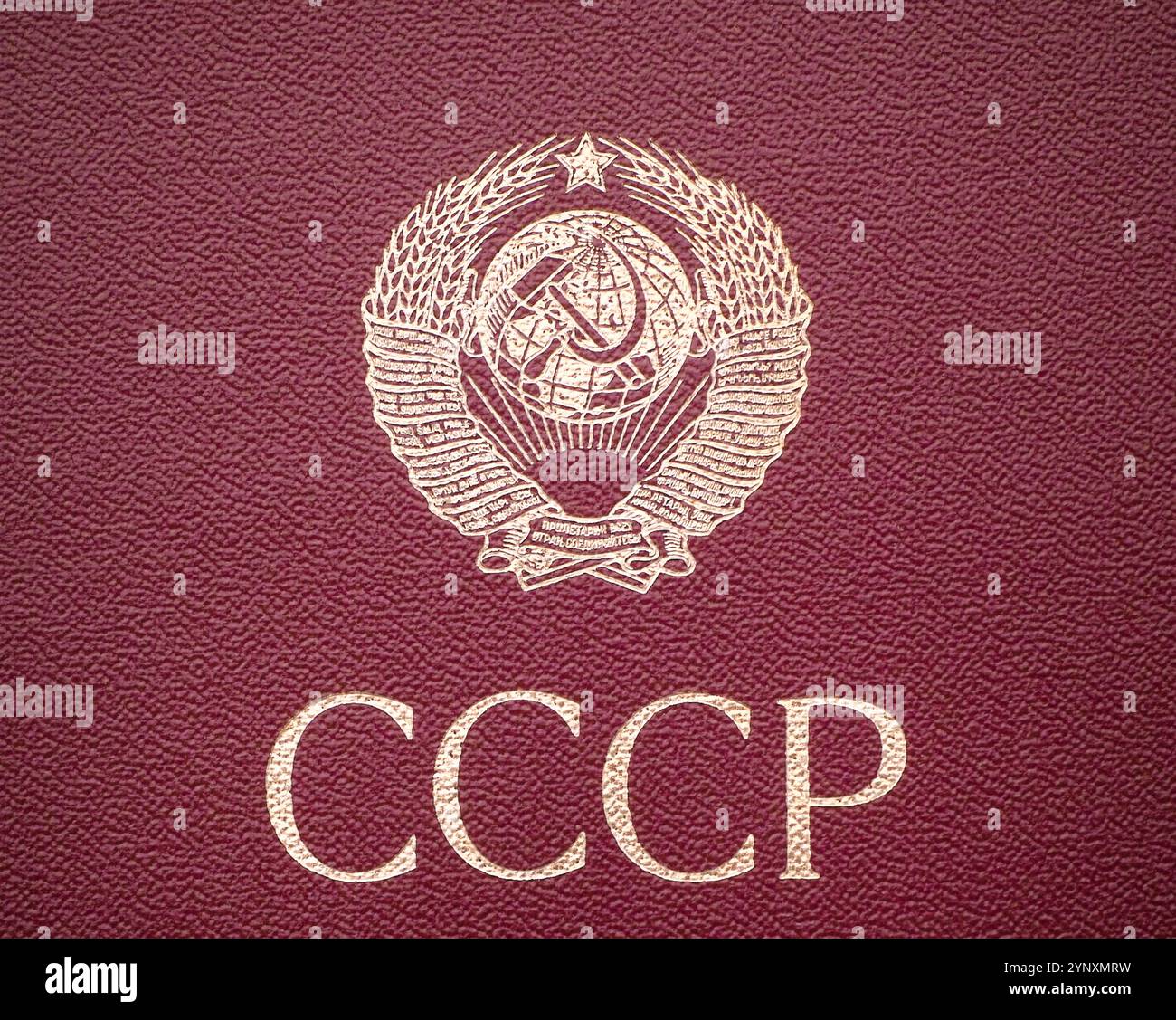 The coat of arms of the USSR on a red background. Close-up Stock Photo ...