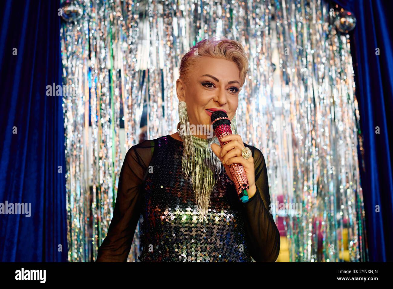 A talented drag queen showcases extravagant makeup and engages the ...