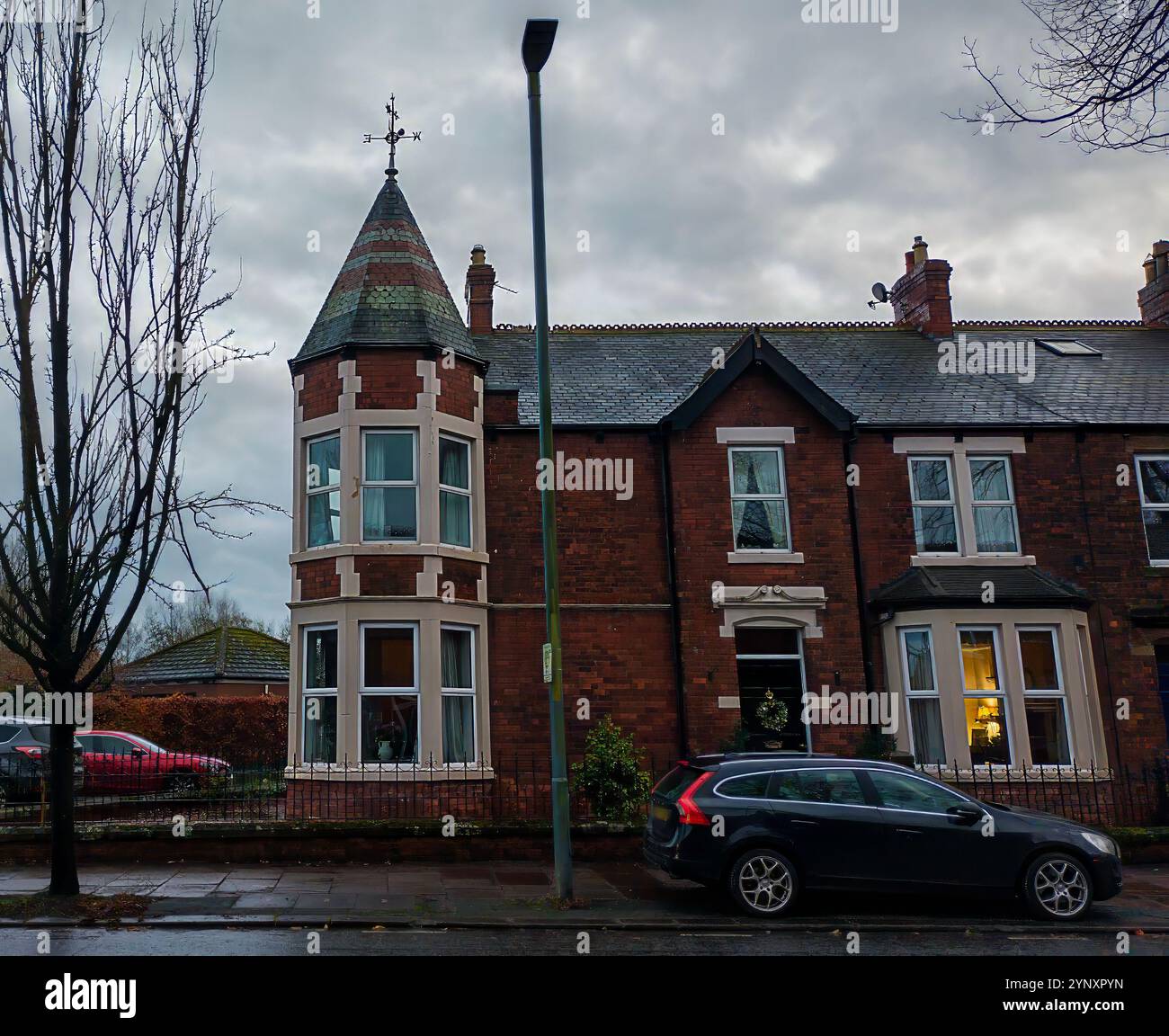 A distinctive round town on the end of a row of terraced houses in ...