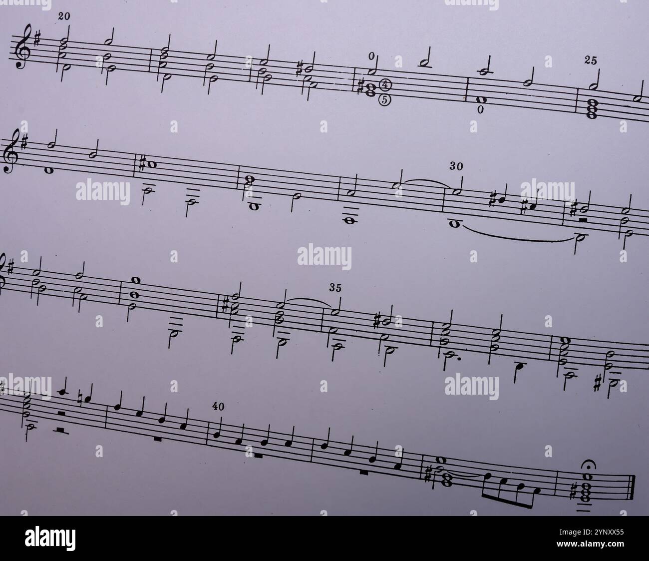 Sheet music is laid out on a flat surface, showcasing musical notes and ...