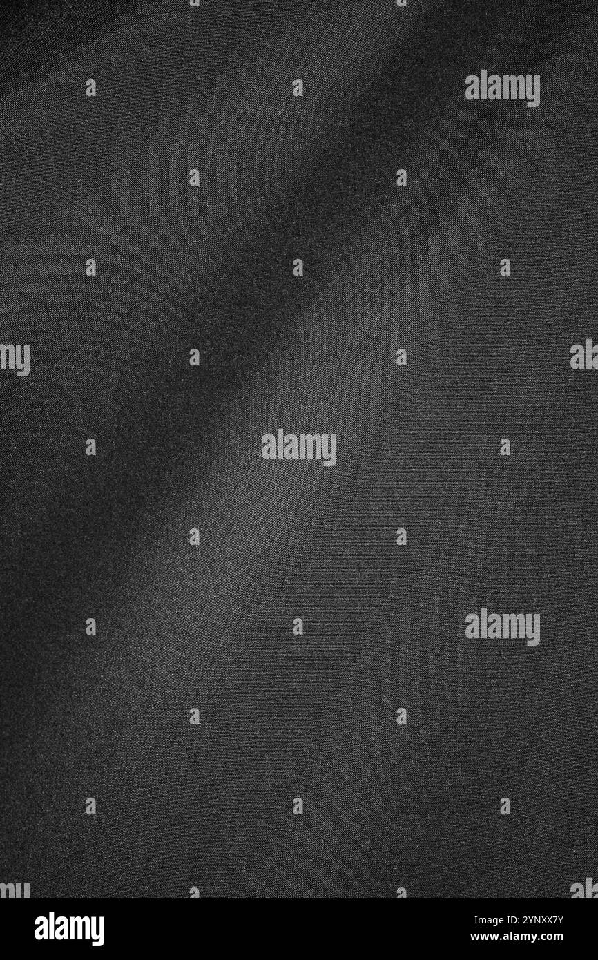 Close-up view showcases a smooth black fabric texture with a subtle ...