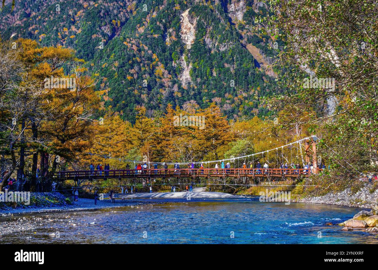 Tourists on the kappa wooden bridge at Kamikochi National park, Nagano ...