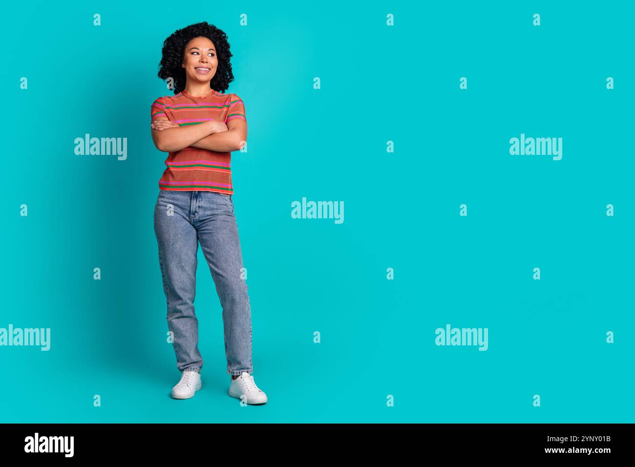 Full body portrait of nice young woman folded arms look empty space ...