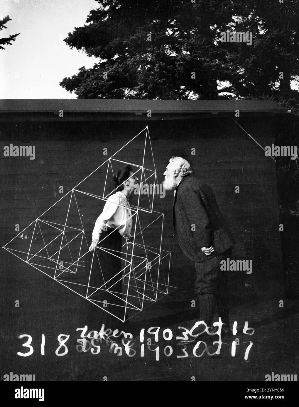 Alexander Graham Bell facing his wife, Mabel Hubbard Gardiner Bell, who ...