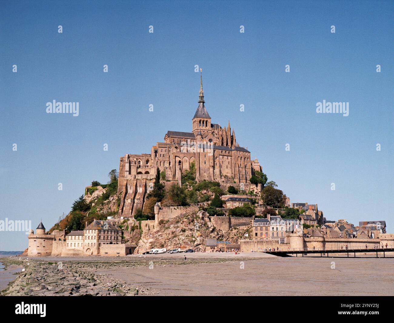 Tidal island of Mont Saint-Michel with a clear blue sky, Normandy ...