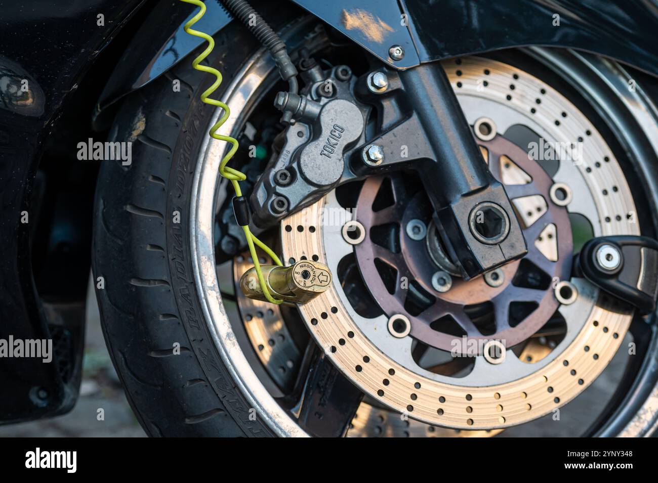A motorcycle wheel is secured with a lock Stock Photo - Alamy