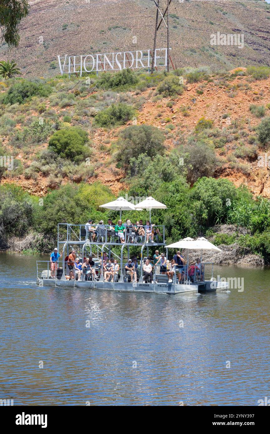 Tourists enjoying a boat trip, cruise on the Breede River, Viljoensdrift Wine Estate, Robertson ...