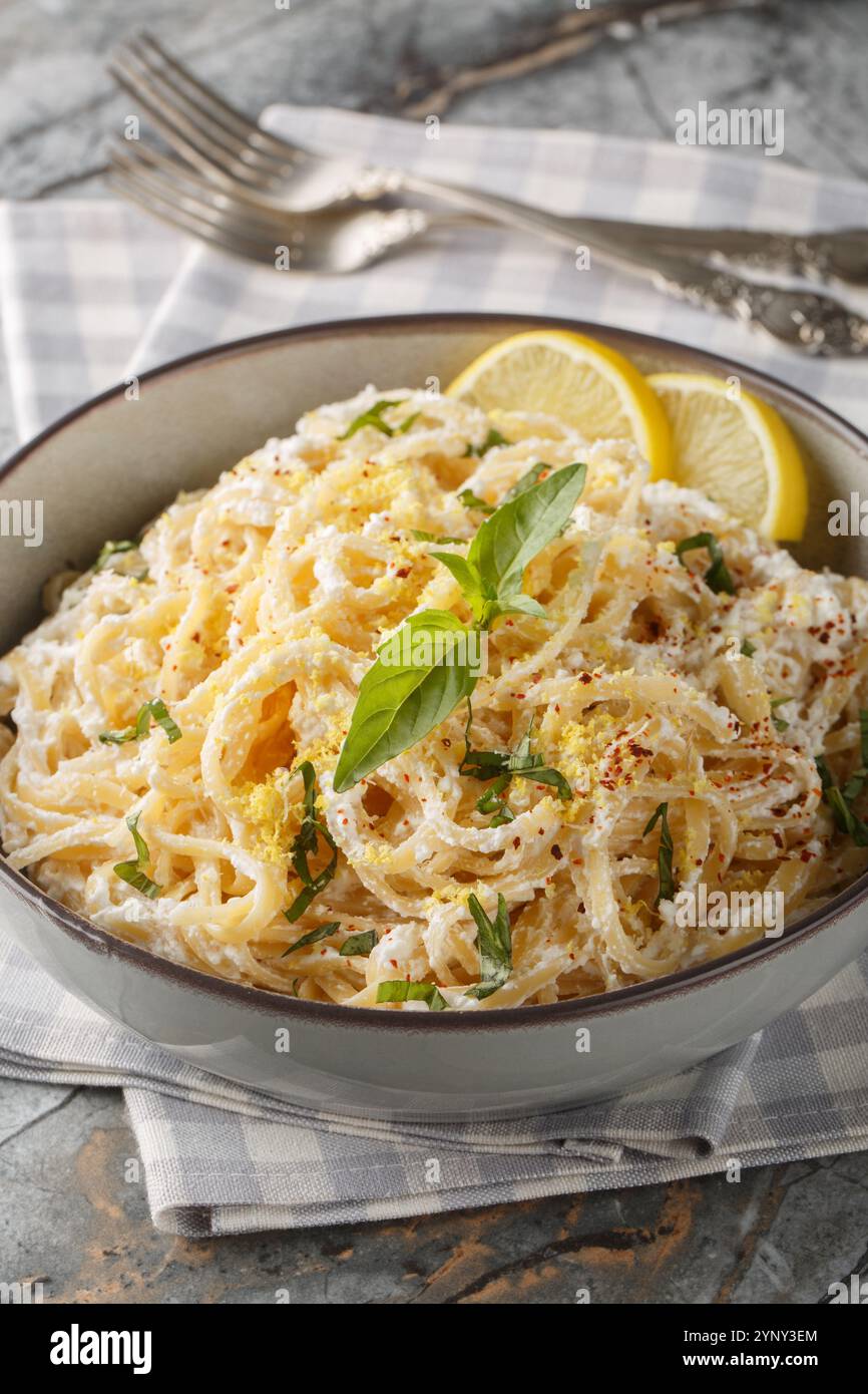 Linguine pasta with lemon zest and ricotta cheese, parmesan close-up in ...