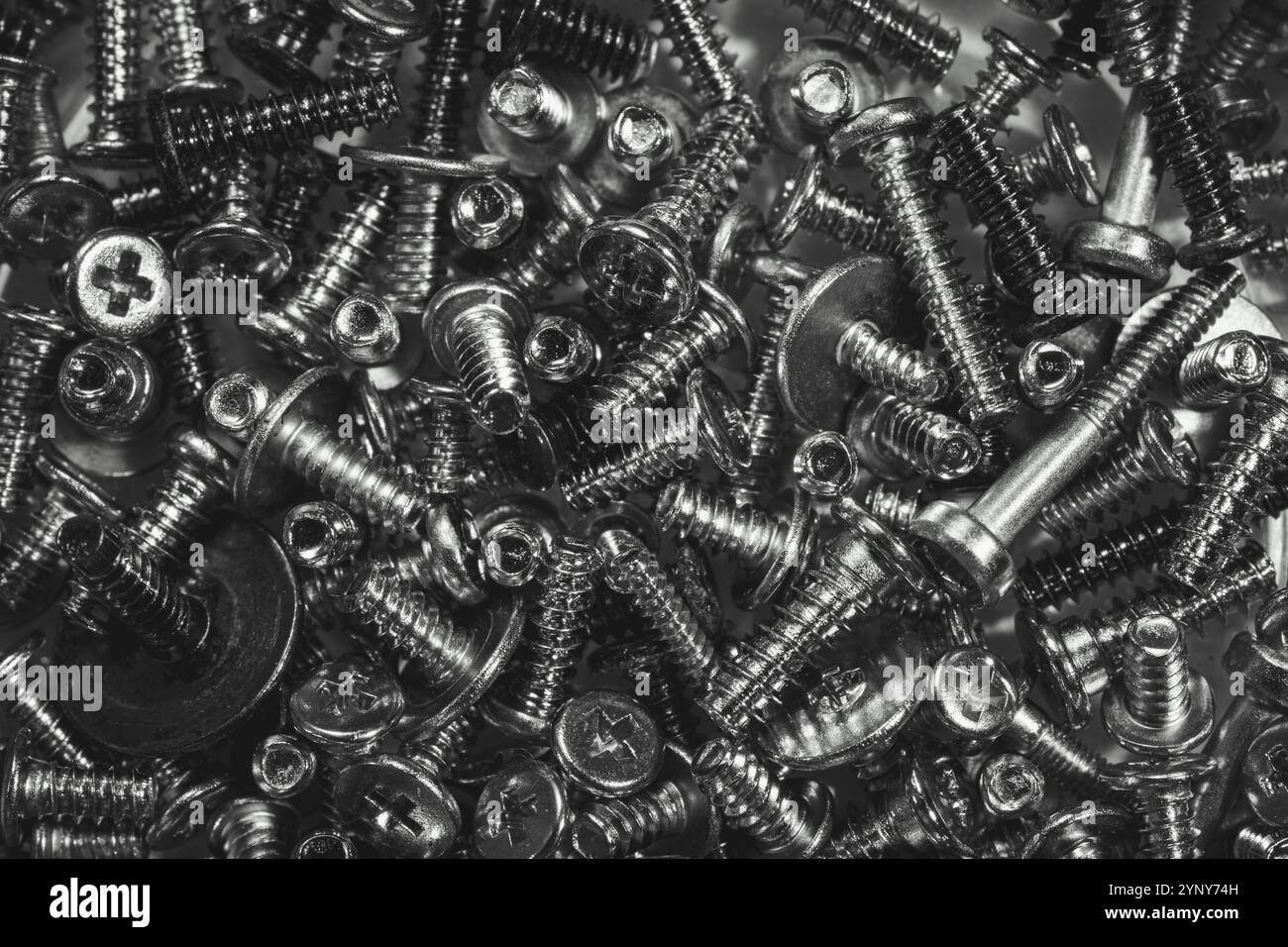 Mixed screws. Industrial background Stock Photo - Alamy