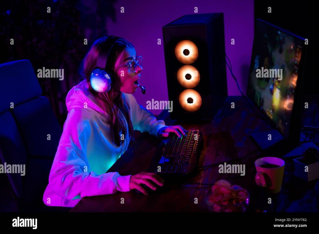 Photo of cute charming blonde girl amazed reaction play gamer computer ...