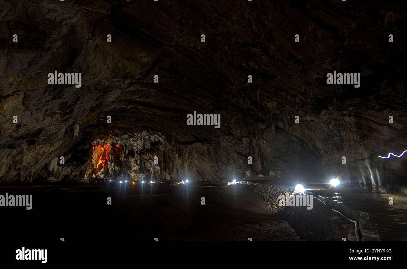 Visitors explore the Cacahuamilpa Caves, showcasing dramatic rock ...