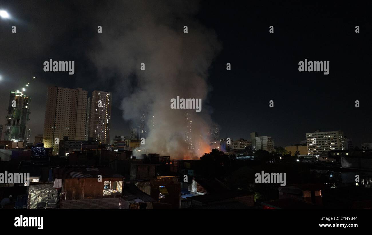 Manila, Philippines. 28th April 2024. In an aerial view, a fire that ...