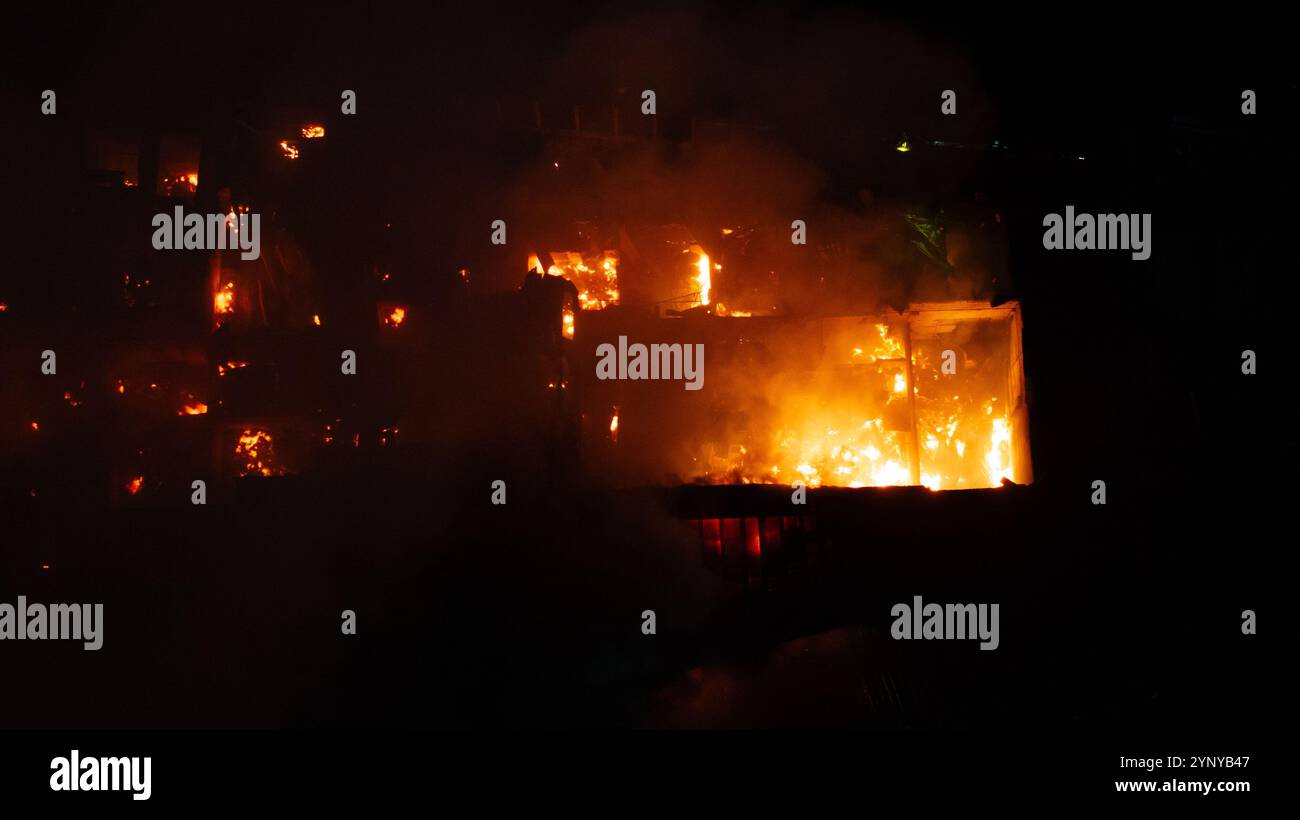 Manila, Philippines. 28th April 2024. In an aerial view, a fire that ...