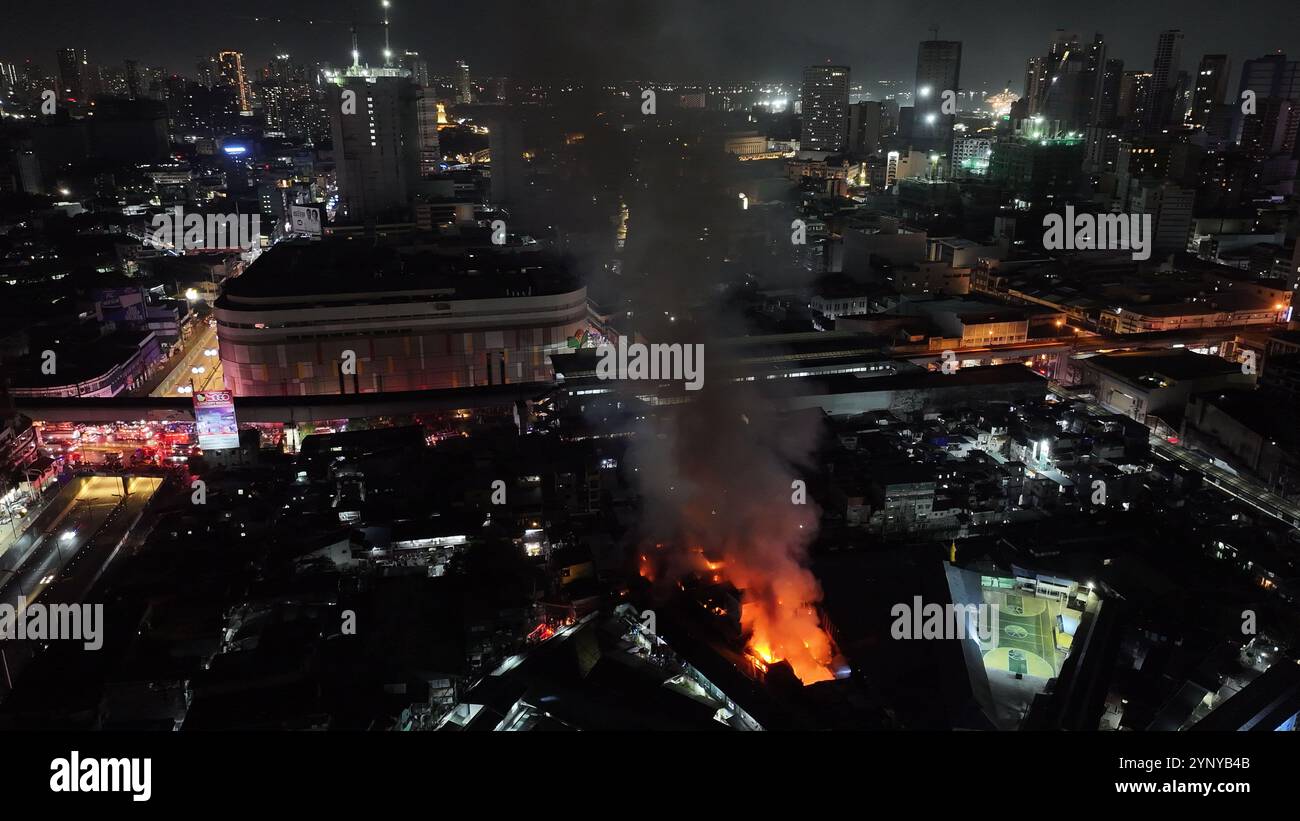 Manila, Philippines. 28th April 2024. In an aerial view, a fire that ...