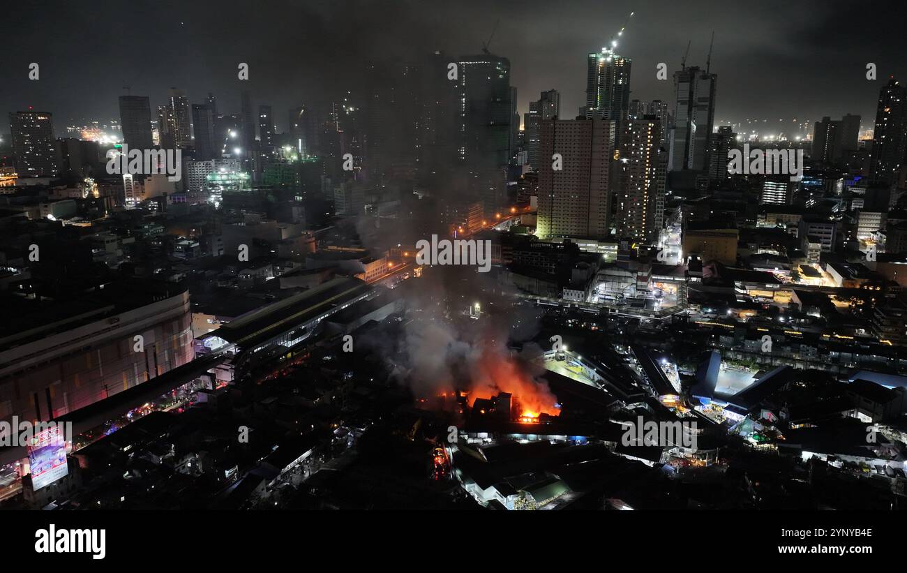 Manila, Philippines. 28th April 2024. In an aerial view, a fire that ...