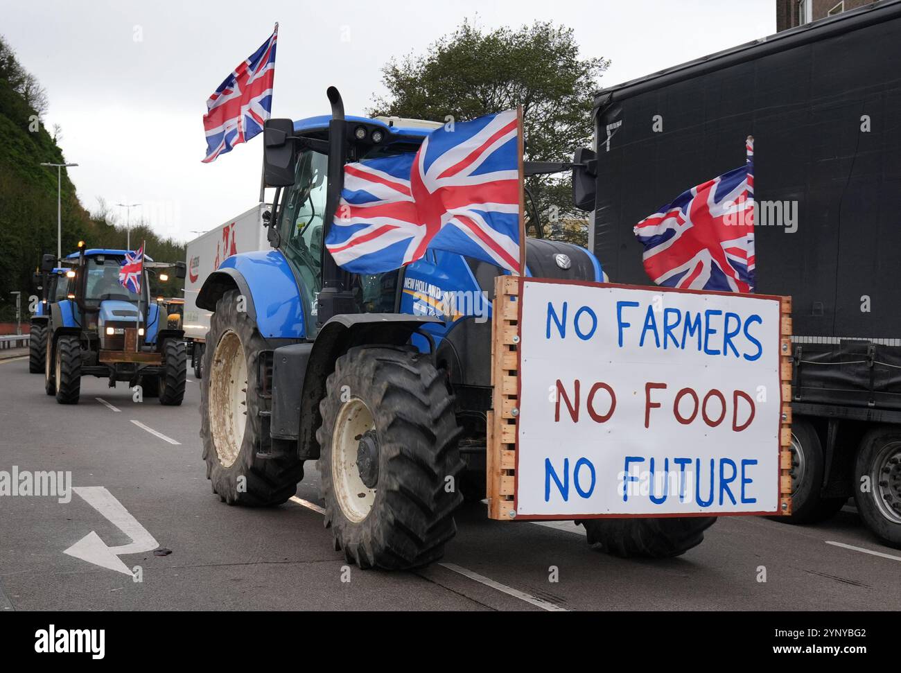 Farmers take part in a go-slow protest in Dover, Kent, to show their ...