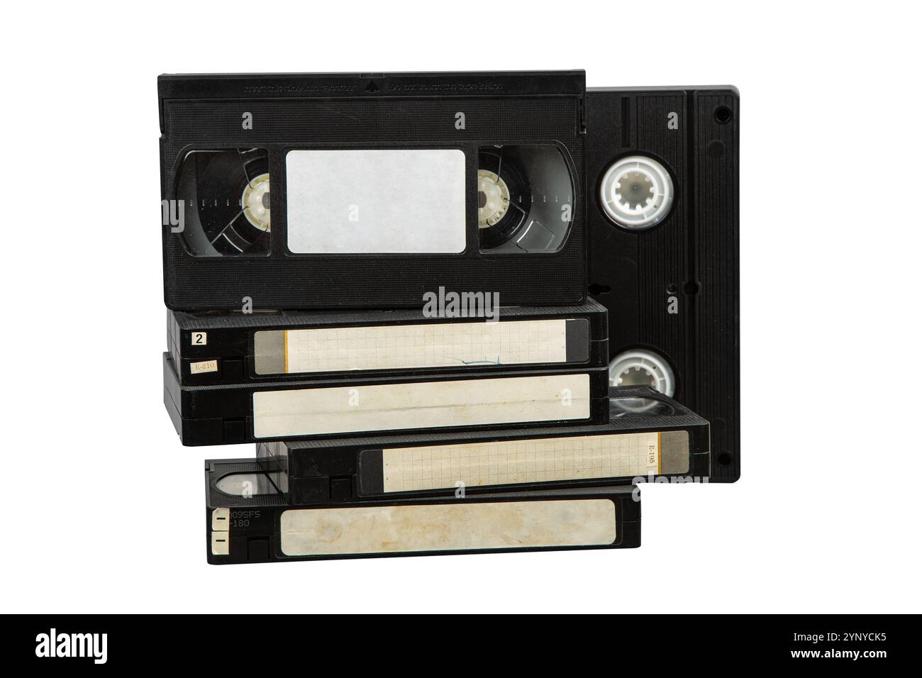 A stack of vintage VHS tapes, isolated on a white background, evokes ...