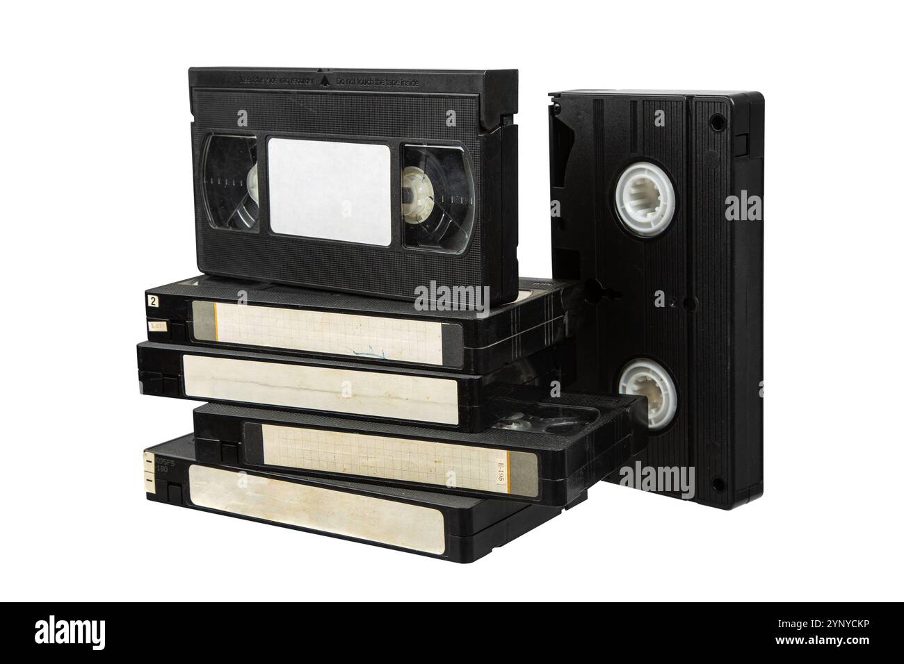 A stack of vintage VHS tapes, isolated on a white background, evokes ...