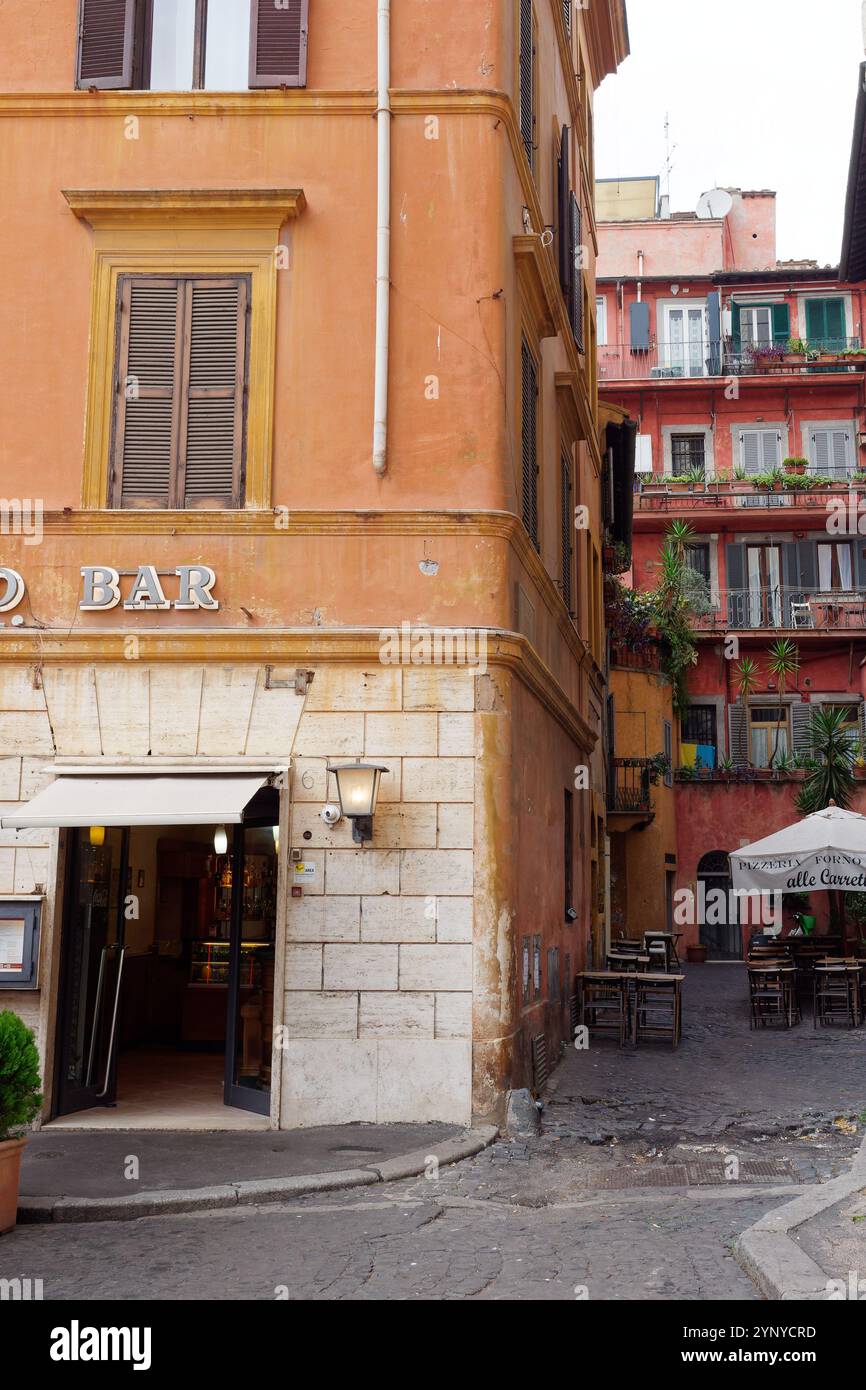 Quaint orange rendered bar and side street in the city of Rome, Italy ...