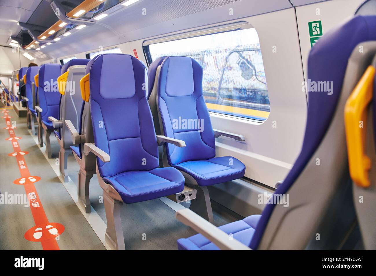 Modern high speed train interior with empty blue seats Stock Photo - Alamy