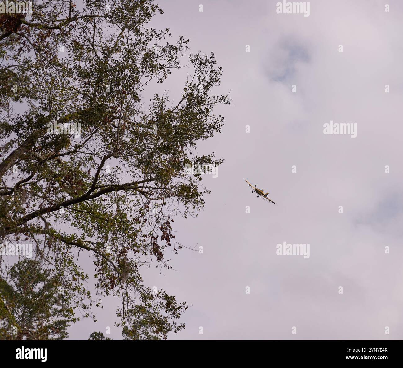 Aerial Tractor crop dusting farming acreage in rural southern Georgia ...