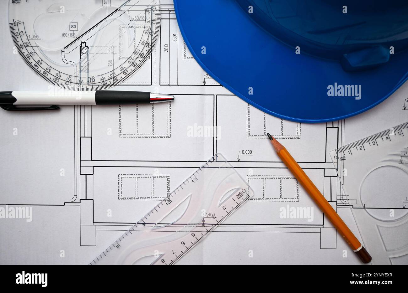 Architectural project planning involves using a blueprint, ruler ...