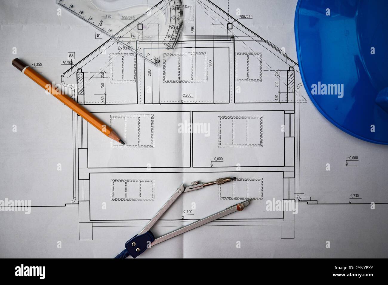 Architectural project being designed with pencil, compass and ...