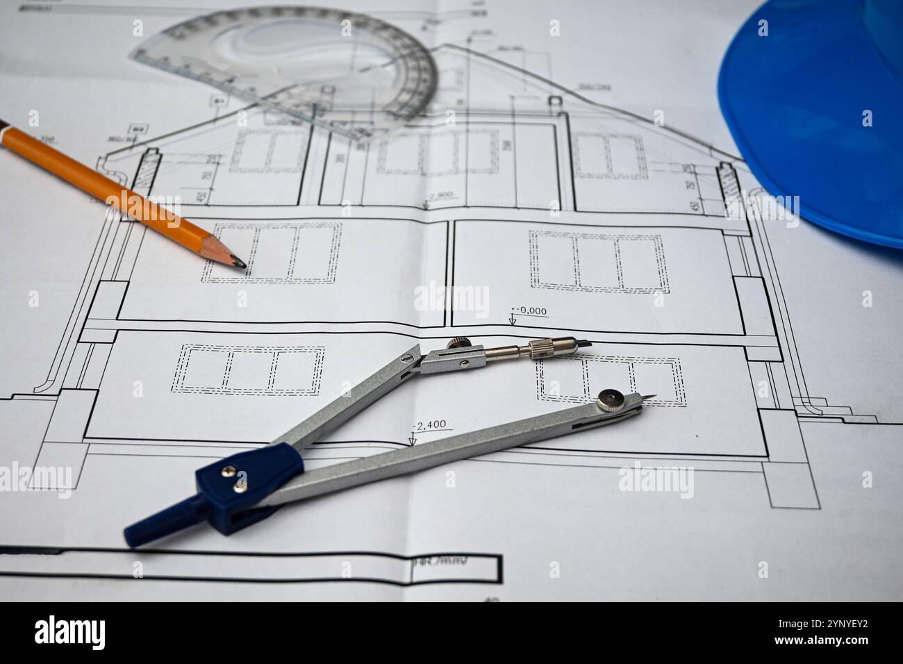 Architectural project being designed with pencil, compass and ...