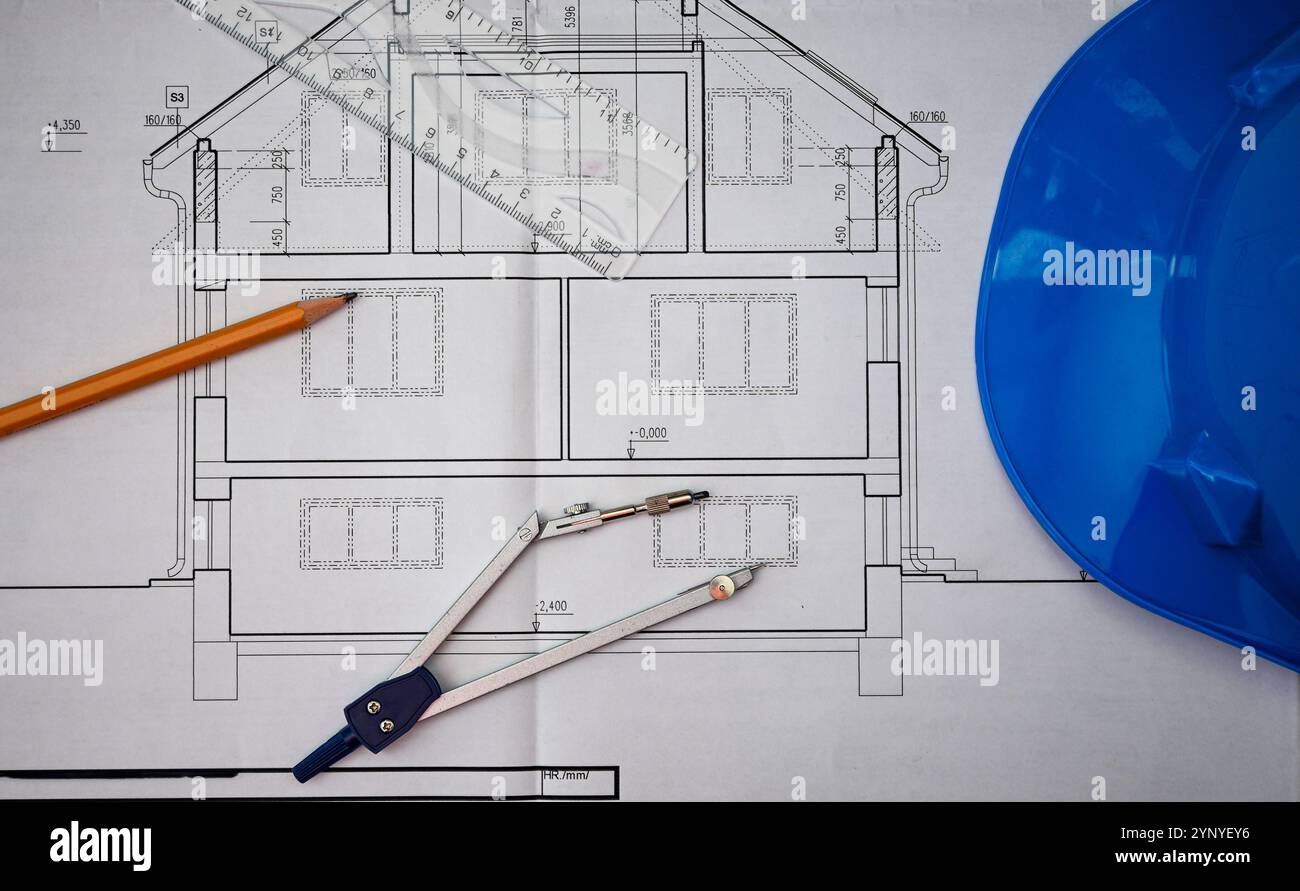 Architectural project being designed with pencil, compass and ...