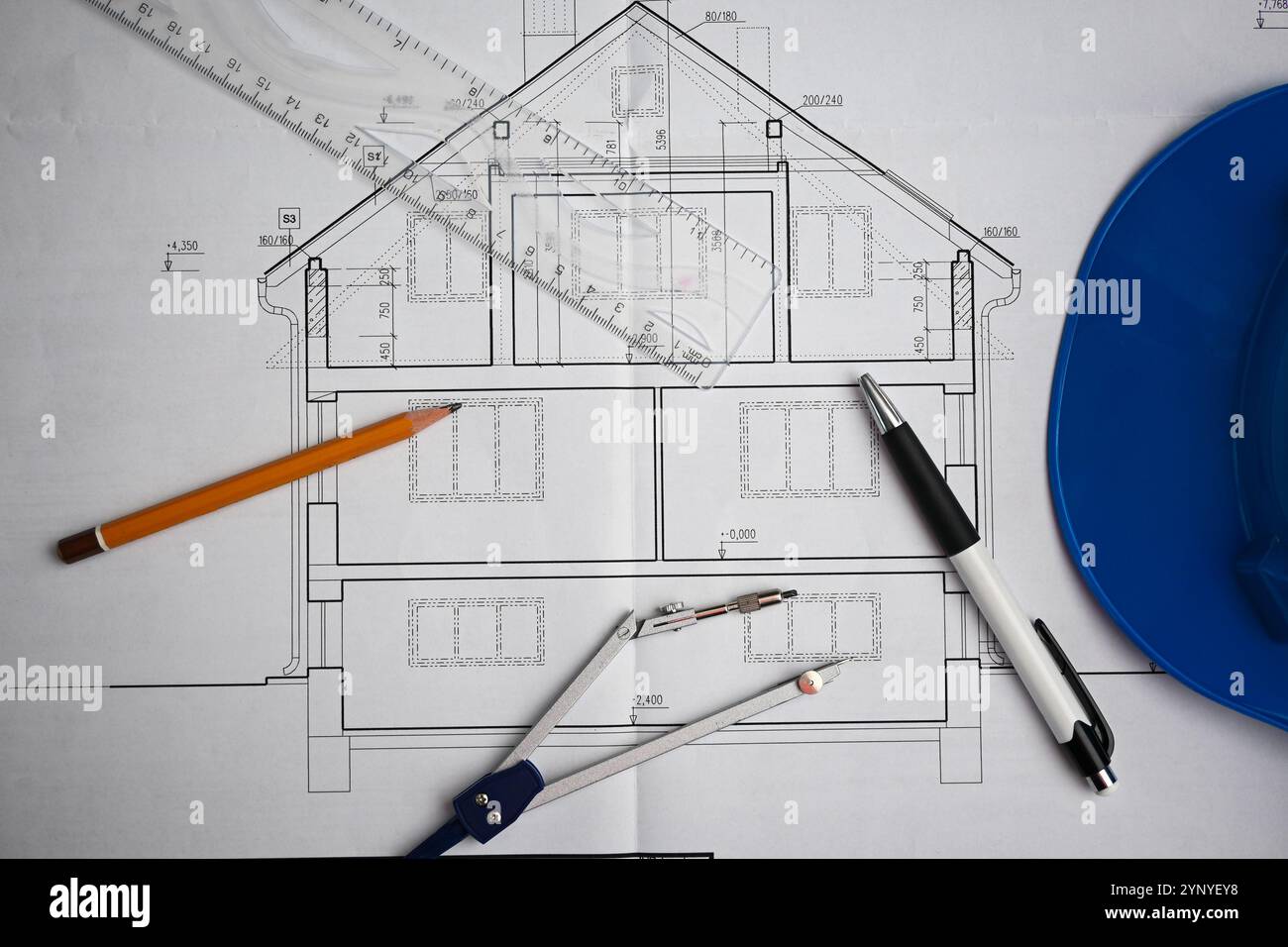 Architectural project being designed with pencil, compass and ...