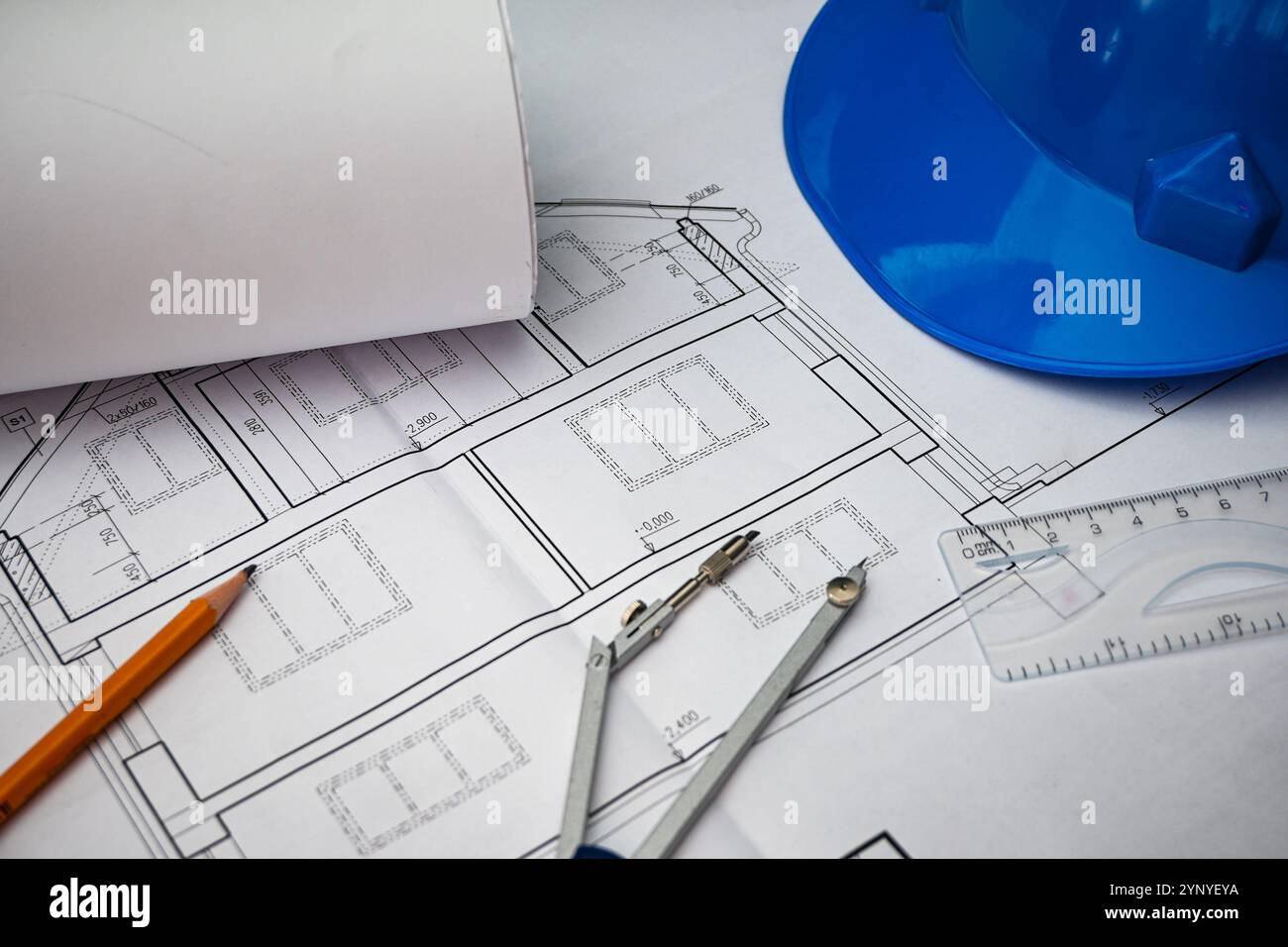 Architectural project being designed with pencil, compass, ruler and ...