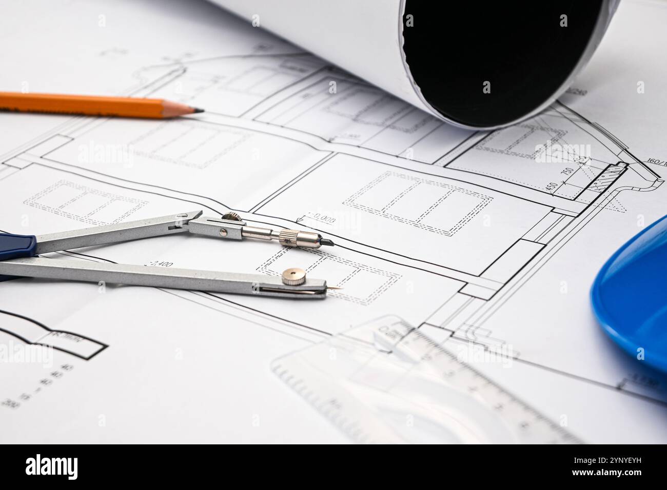 Architectural project being designed with pencil, compass, ruler and ...